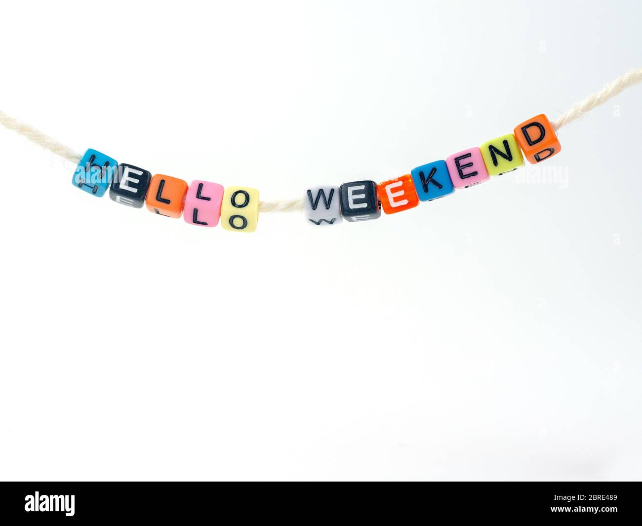Hello weekend word written on color blocks, Hello weekend text on white ...