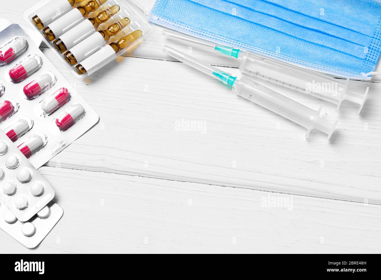Medical capsules, ampules and face masks close up Stock Photo - Alamy