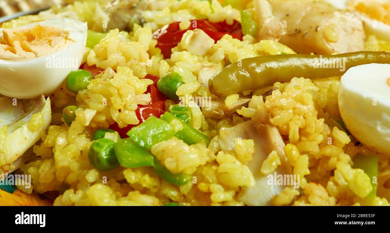 Smoked Spanish paprika paella with cod close up Stock Photo - Alamy