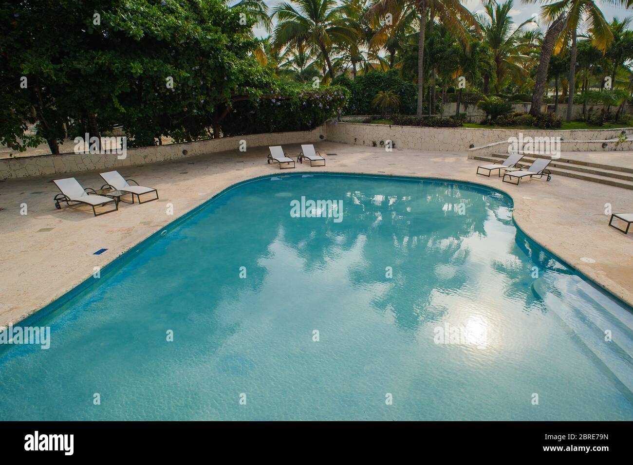 Pool bed at the blue swimming pool in Tropical Paradise. Dominican ...