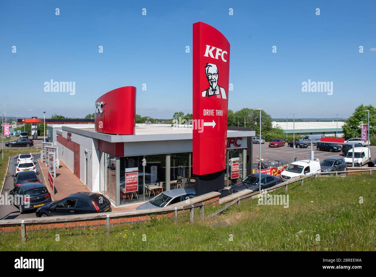Cars queue at a KFC drive-thru in Leicester as the fast food chain ...
