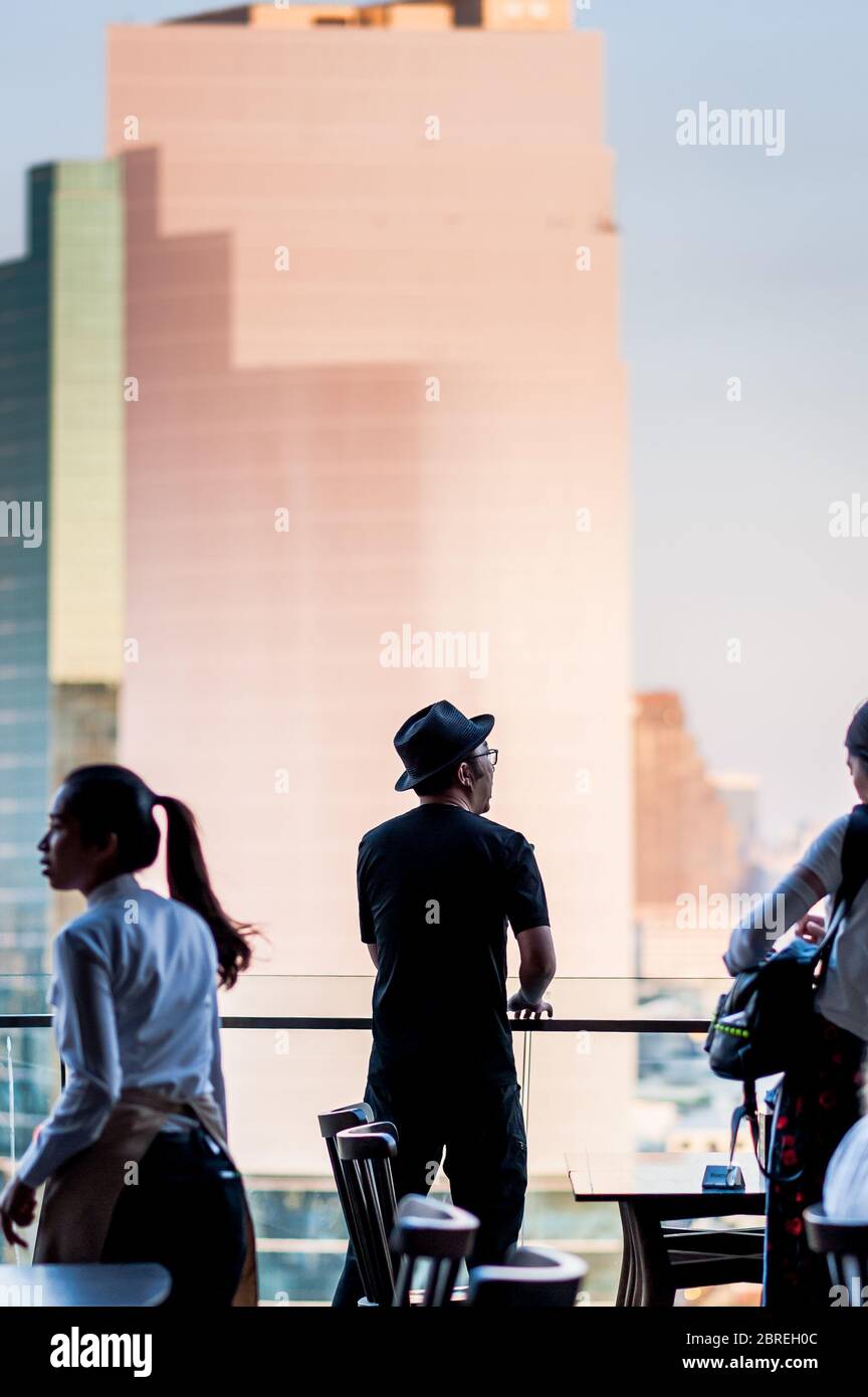 Guests at a restaurant on the balcony of Iconsiam Shopping Mall enjoy ...