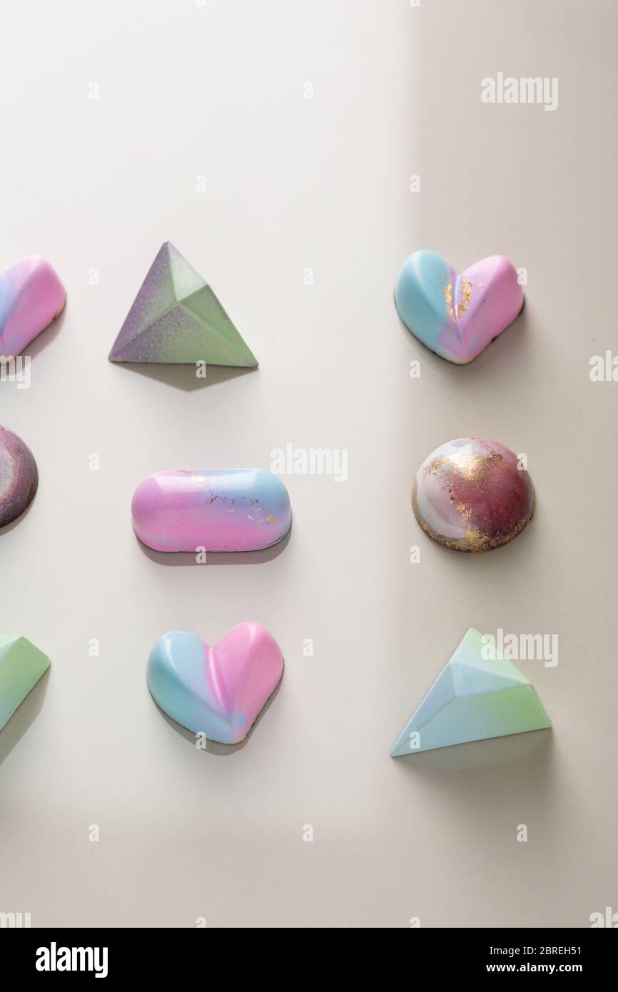 Pastel colour chocolate candies set Stock Photo - Alamy