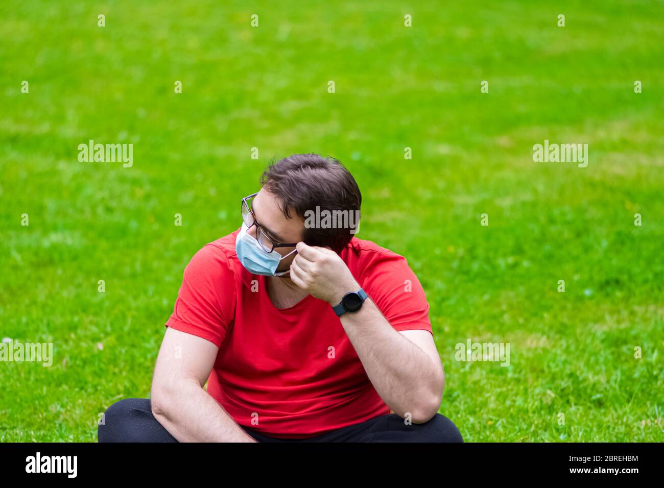 Fat man taking off face mask to inhale some fresh air Stock Photo - Alamy