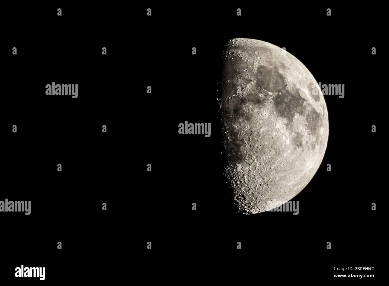 The first quarter moon or half moon photographed at night off-set to ...