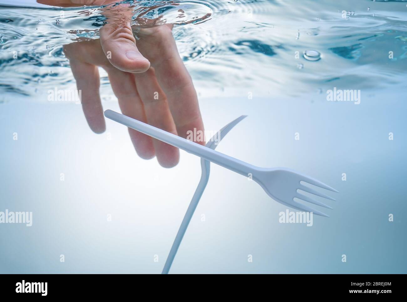 Ecological problem of water pollution, the environment. Hand pulling ...