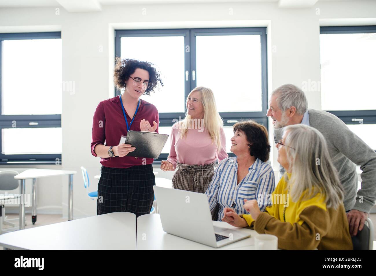Group of senior people attending computer and technology education ...