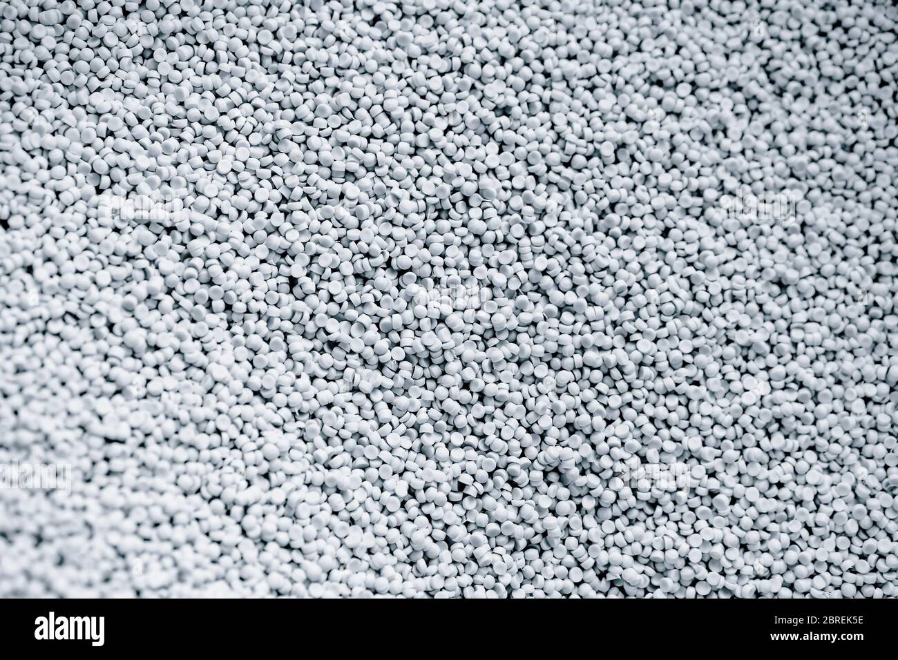 White Plastic Polymer Granules for cable production Stock Photo - Alamy