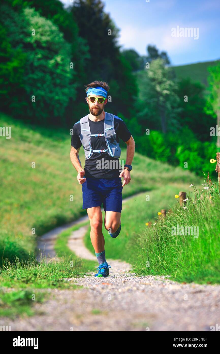 Hill training of a long distance runner Stock Photo - Alamy