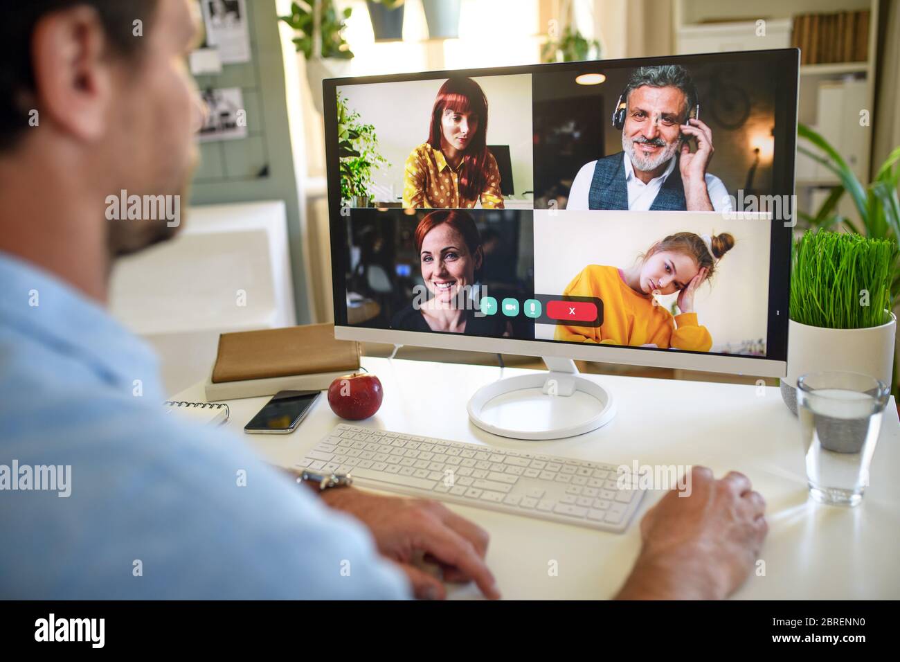 Unrecognizable man having video call on computer at home Stock Photo ...