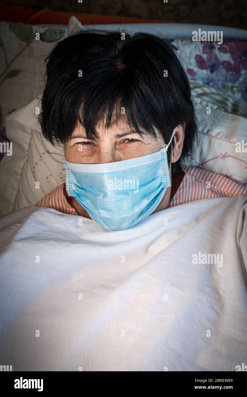 Old woman dying with face mask, Spain, Europe Stock Photo - Alamy