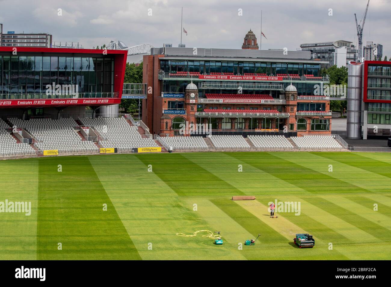 Groundsman David Shortt works on the pitch at Emirates Old Trafford ...