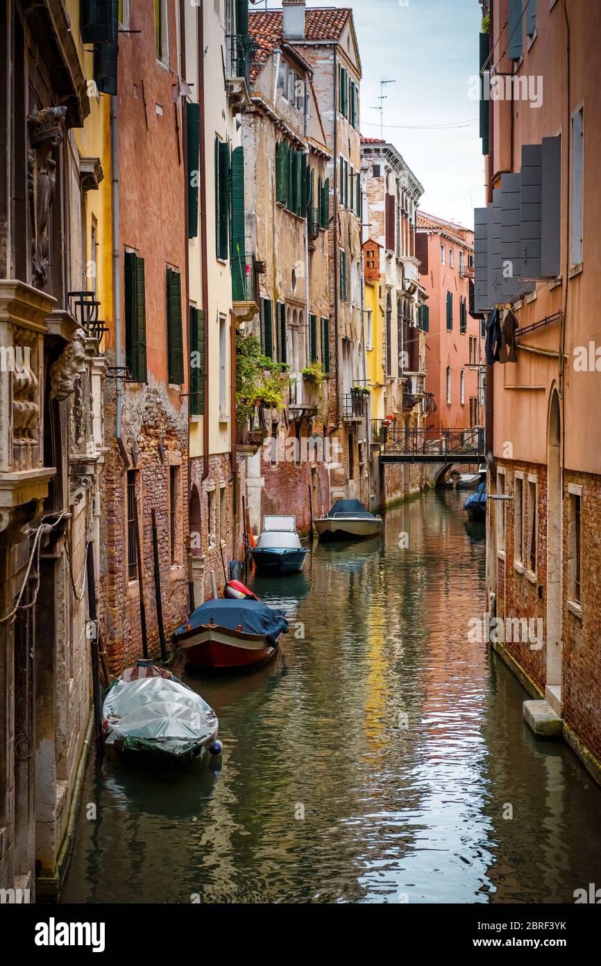 The old narrow street with a boats in Venice, Italy. Traditional ...