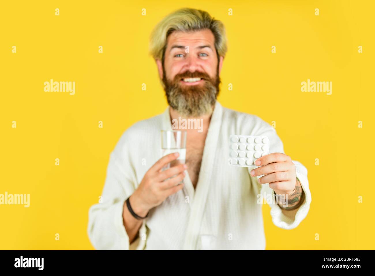 it realy helps. consequences of hangover. man take pill against ...