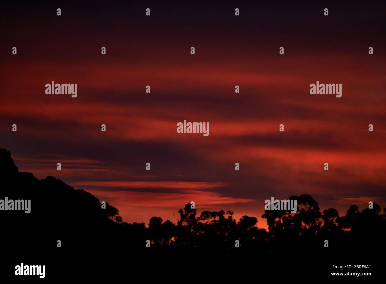 Fiery red sunset over Coetzenberg Stellenbosch Stock Photo - Alamy