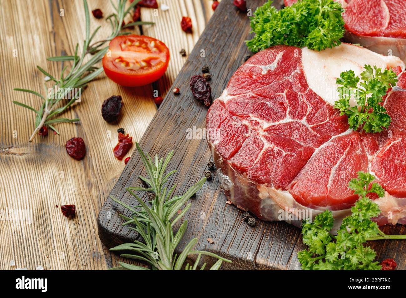 Raw meat slice for grill with seasoning Stock Photo - Alamy