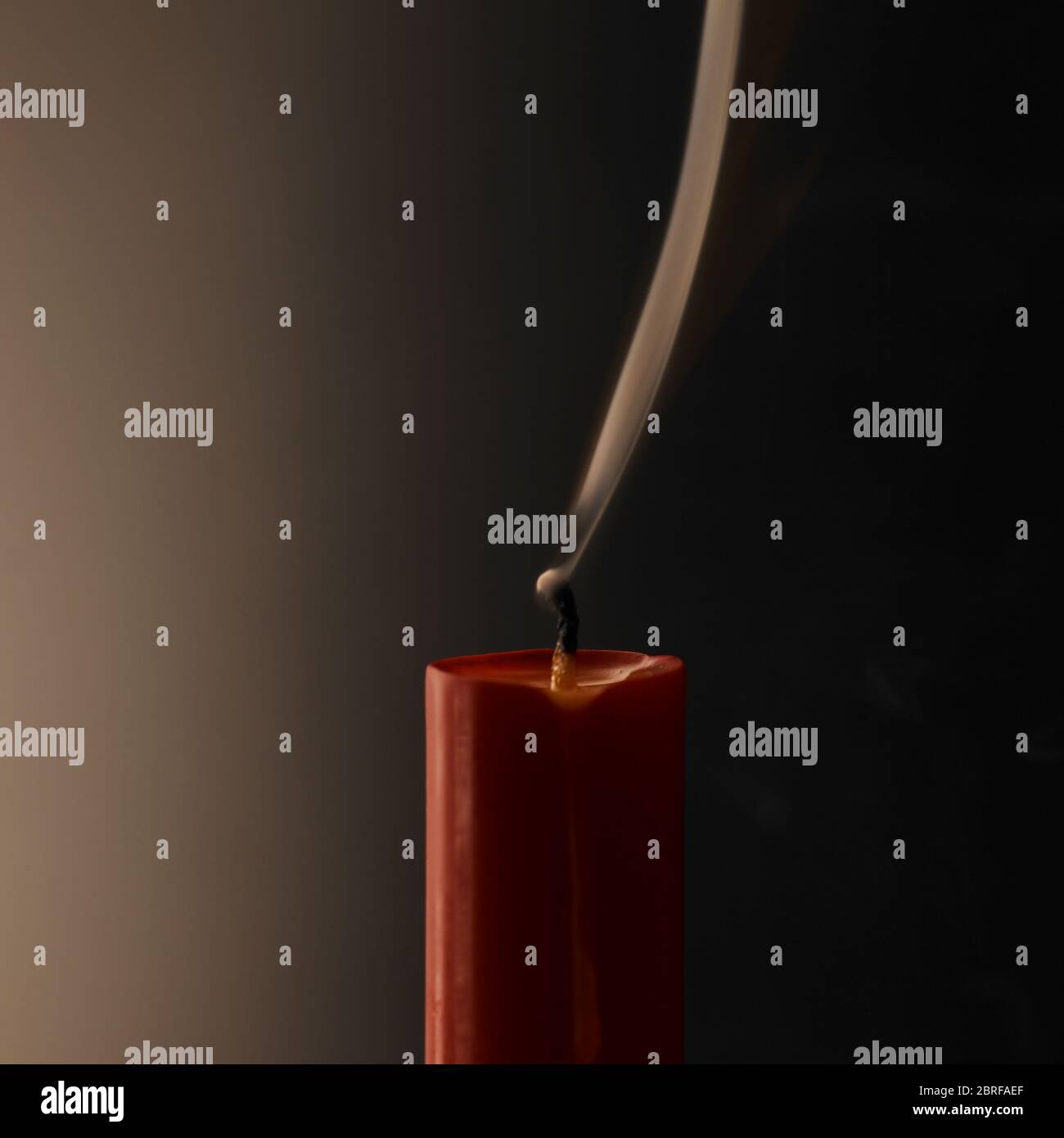 Smoke rising from an extinguished candle Stock Photo - Alamy