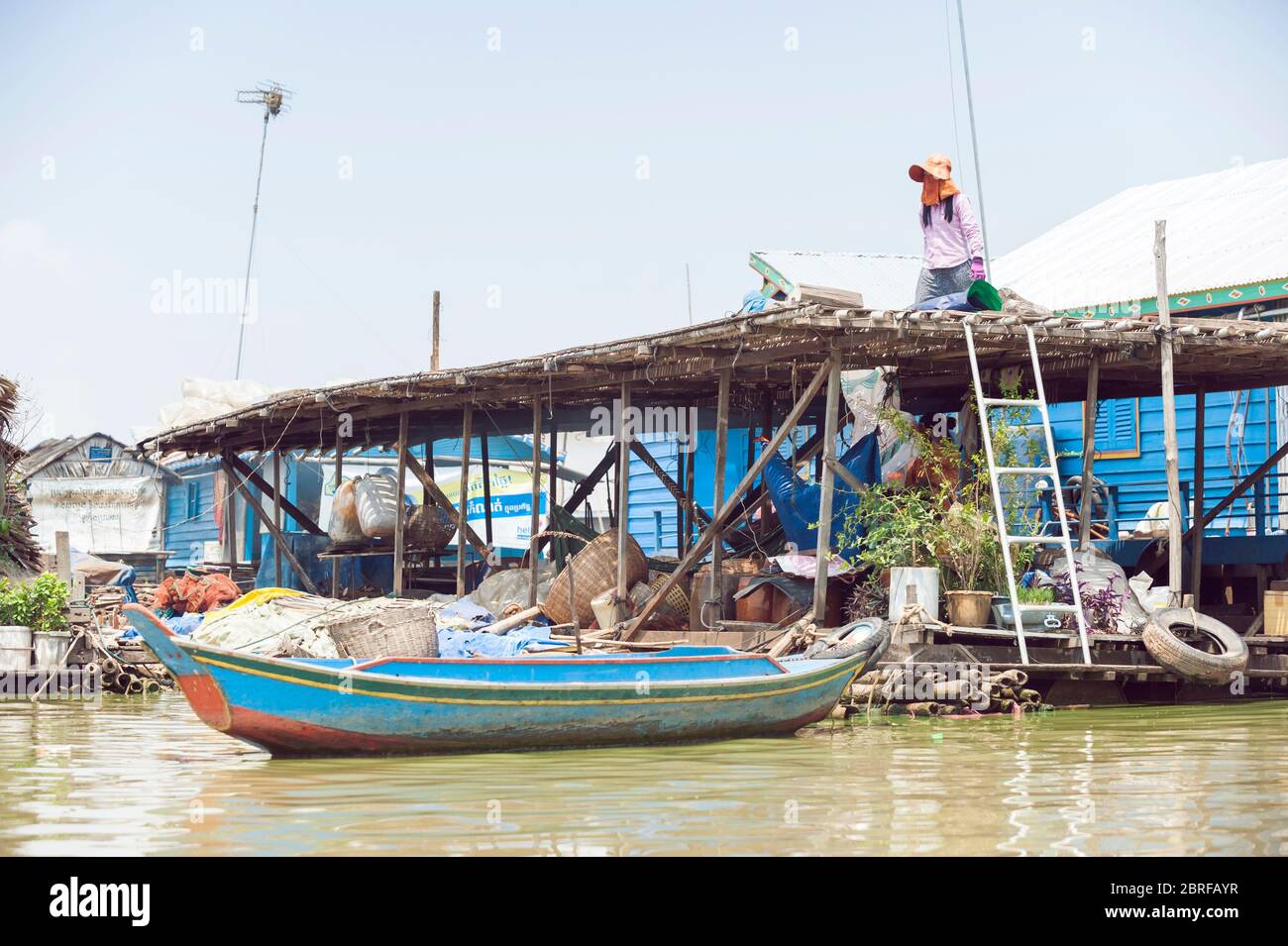 Floating workstation and riverboat at Kompong Luong floating Village ...