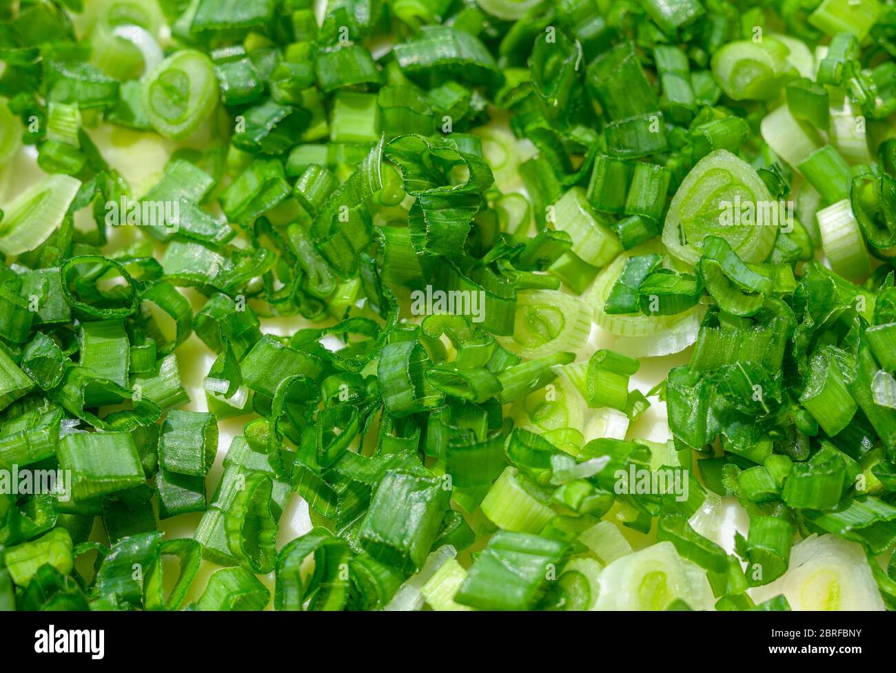 Finely chopped green onions - natural food background Stock Photo - Alamy