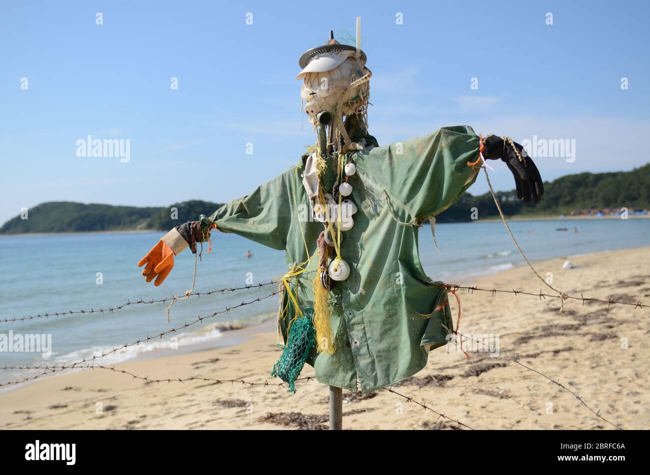 Scarecrow made of plastic and other rubbish thrown out of the sea ...
