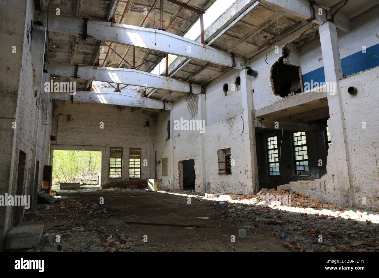 view inside ruin of lost and broken industrial building Stock Photo - Alamy