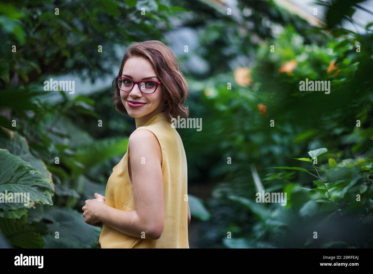 Beautiful woman in botanical hi-res stock photography and images - Alamy