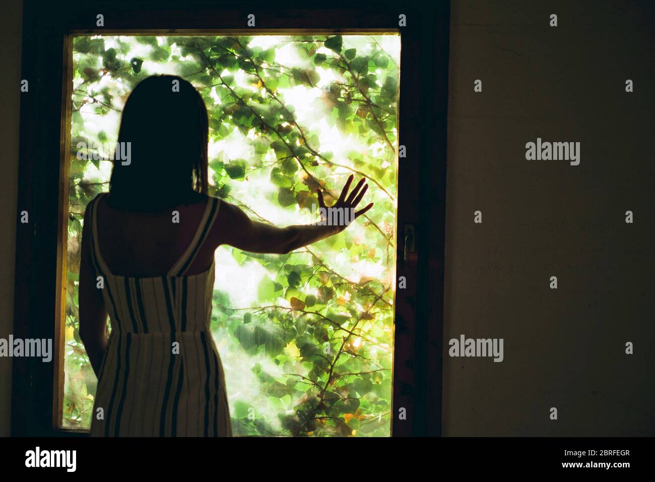 woman stay on window nature view alone woman Stock Photo - Alamy