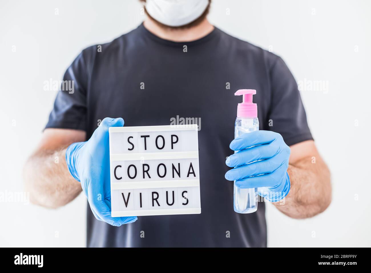 Hand sanitizer hygiene alcohol gel bottles and lightbox with text Stop ...