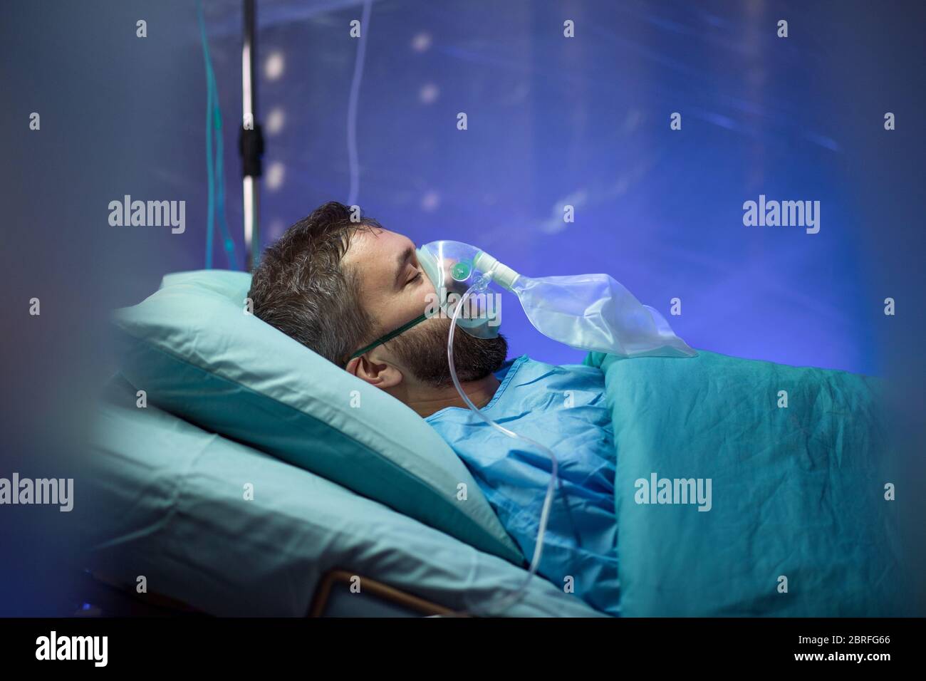 Infected patient in quarantine lying in bed in hospital, coronavirus ...