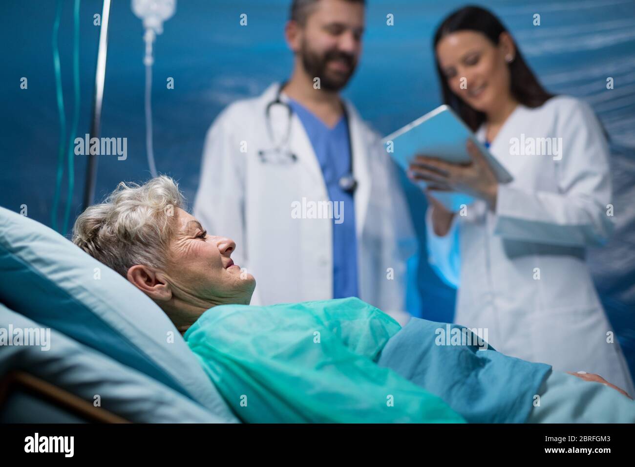 Infected patient in quarantine lying in bed in hospital, coronavirus ...