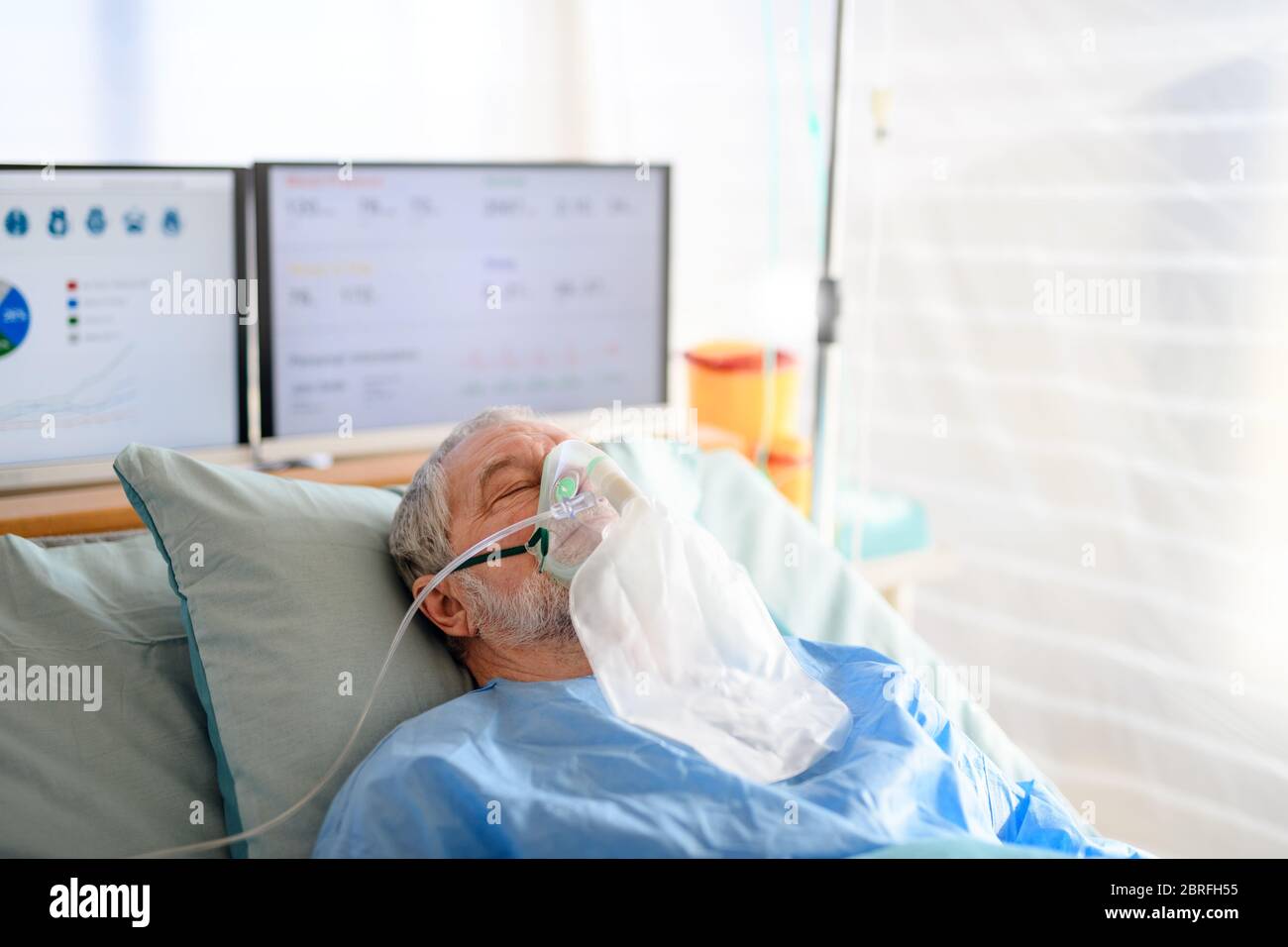 Infected patient in quarantine lying in bed in hospital, coronavirus ...