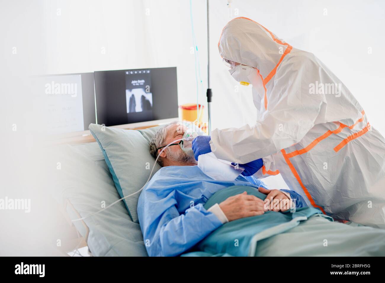 Infected patient in quarantine lying in bed in hospital, coronavirus ...