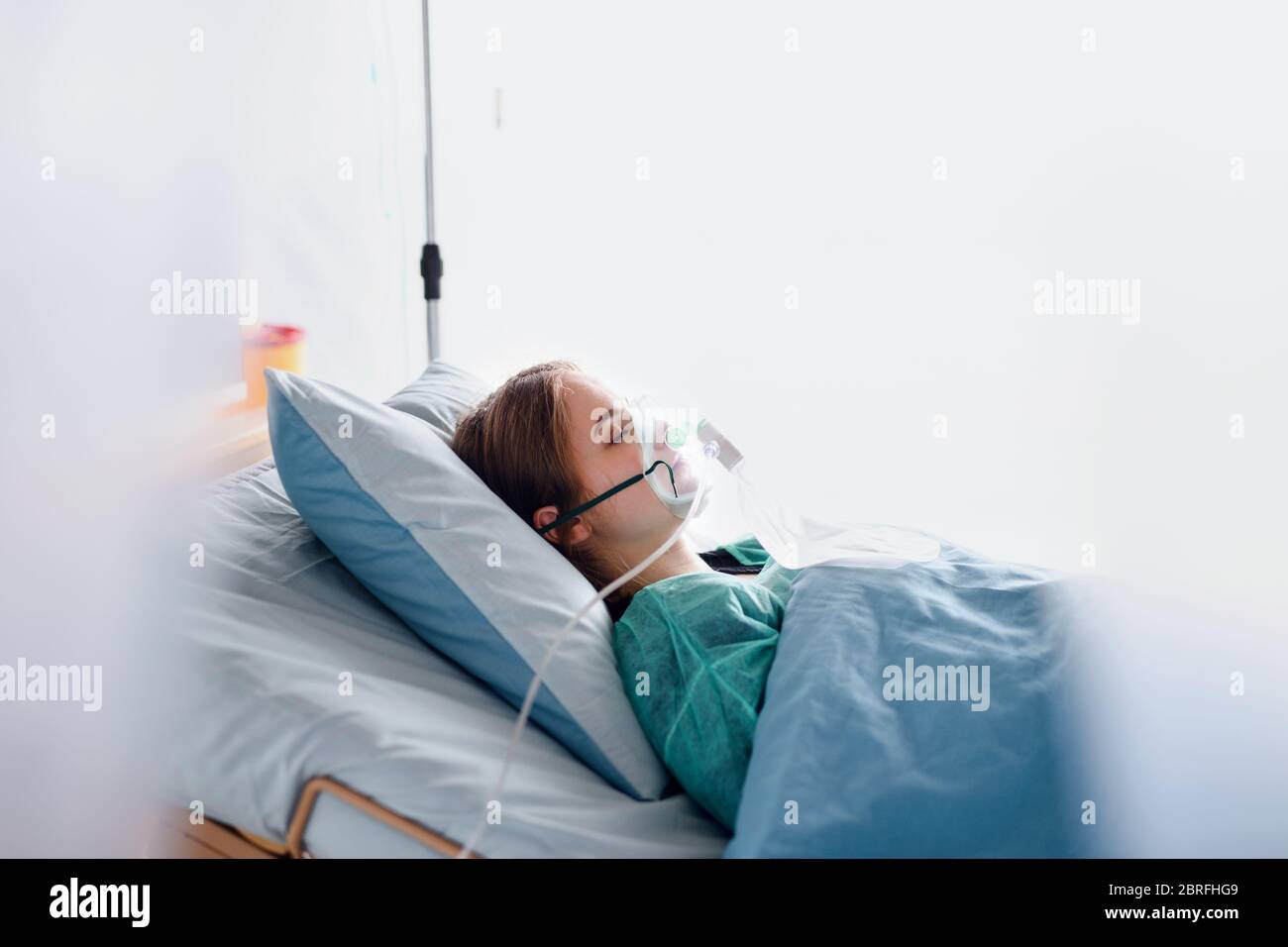 Infected patient in quarantine lying in bed in hospital, coronavirus ...