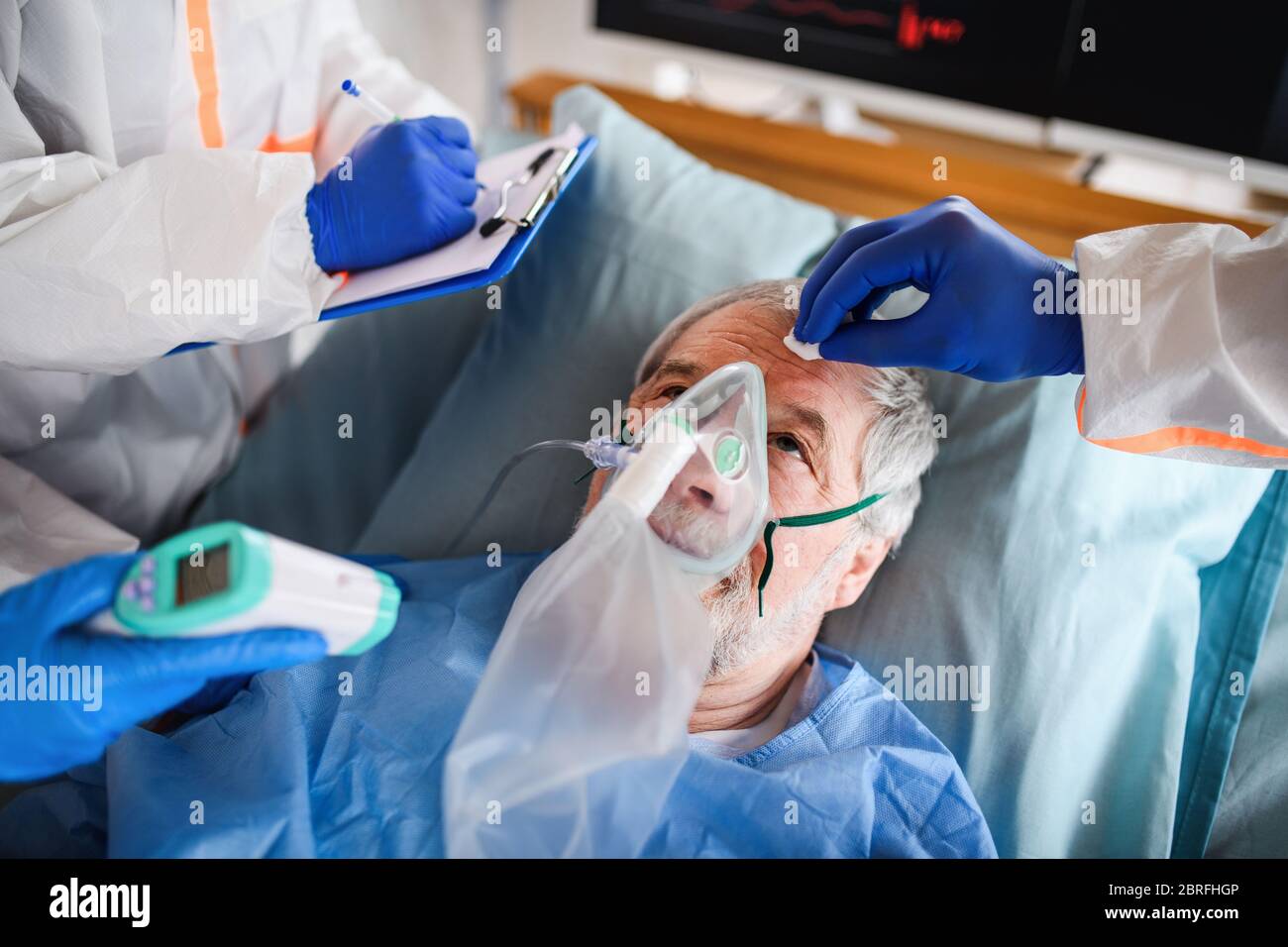 Infected patient in quarantine lying in bed in hospital, coronavirus ...