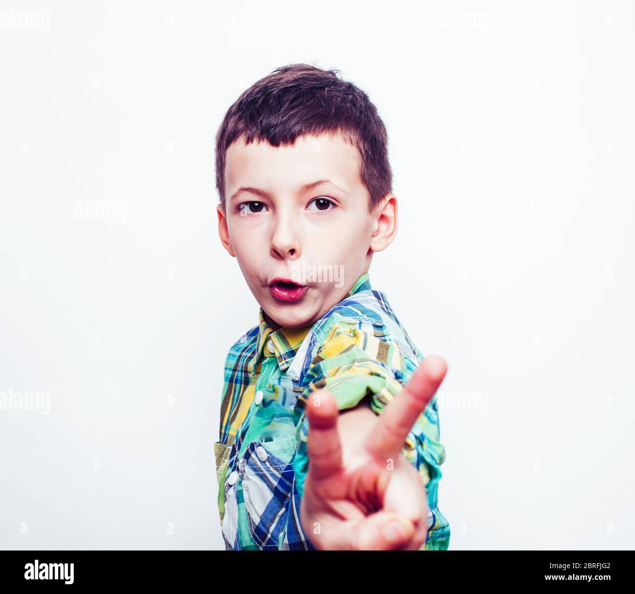 little cute real boy on white background gesture smiling close up ...