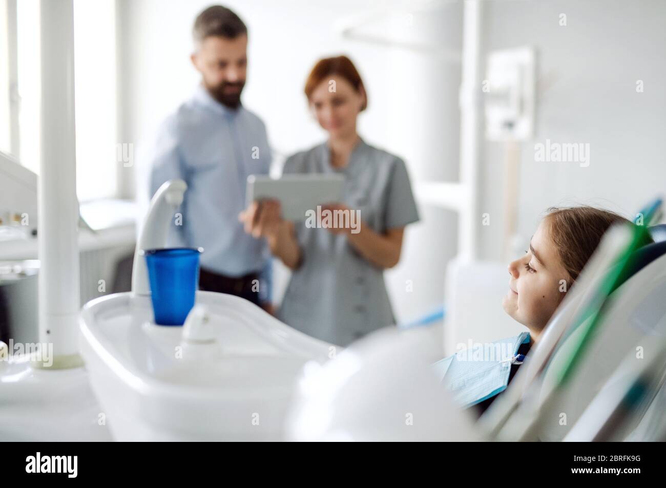Annual dental check-up of a child with father in dentist surgery Stock Photo - Alamy