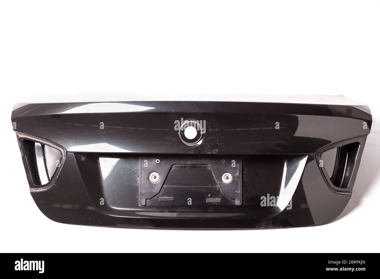 Black metallic boot lid on a white isolated background in a photo ...