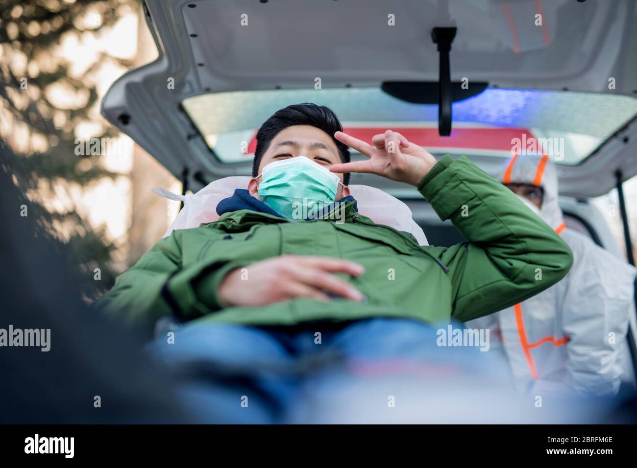 Man on stretcher by ambulance outdoors, coronavirus concept Stock Photo ...
