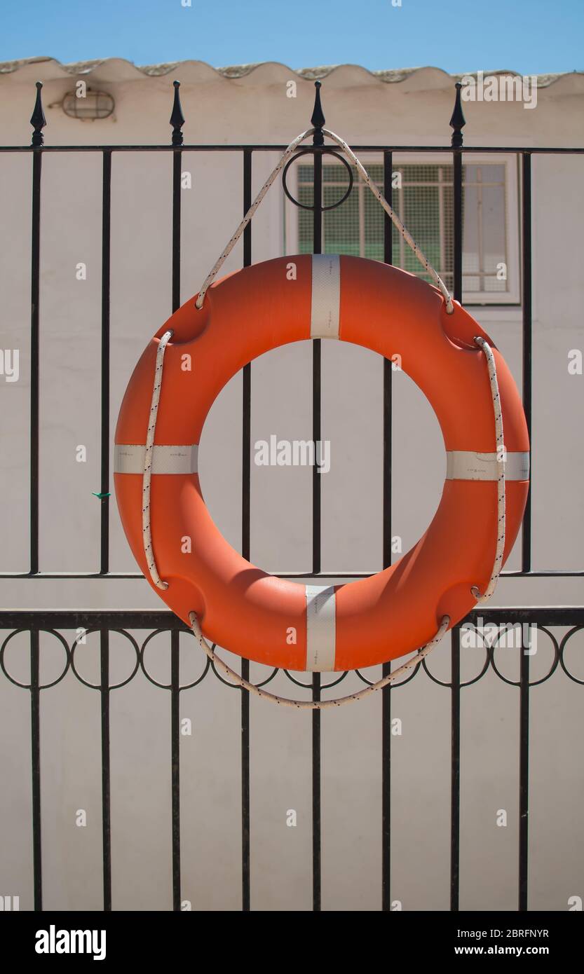 Life saving ring on a fence, in a public swimming pool Stock Photo - Alamy
