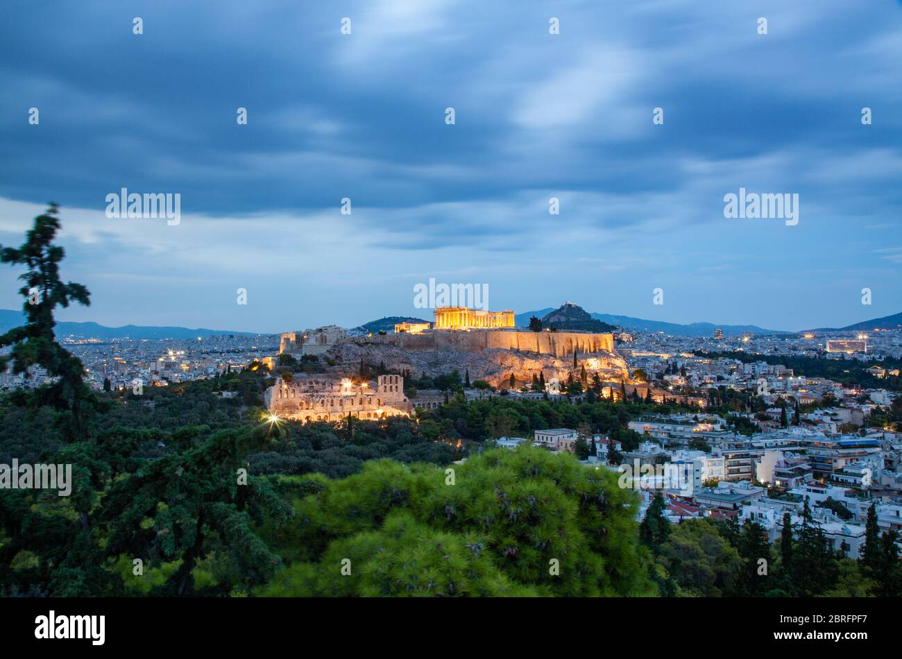 athens seen from Philopapou hill with views to Herodium , Acropolis and the Parthenon at blue ...