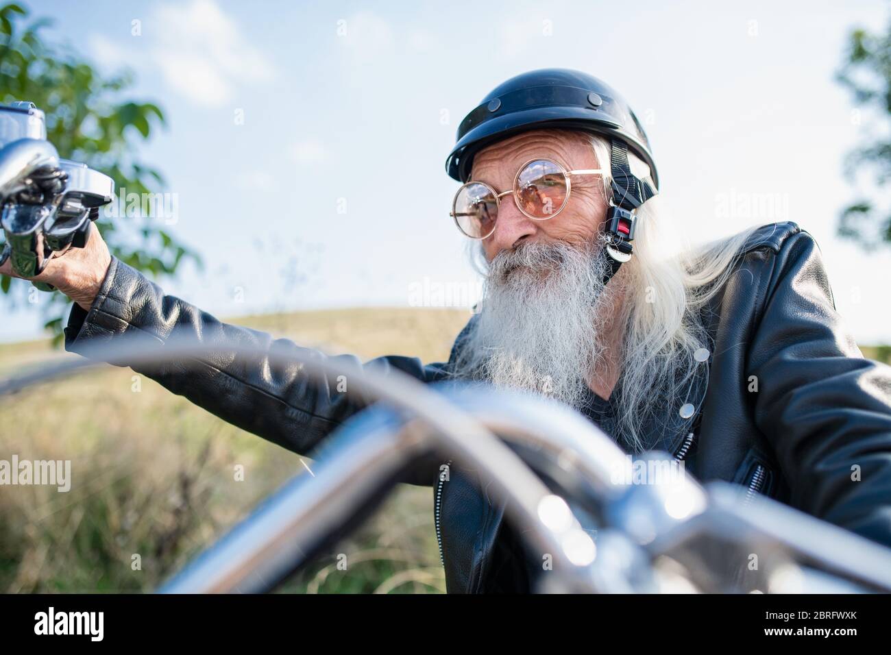 Elderly man motorbike hi-res stock photography and images - Alamy
