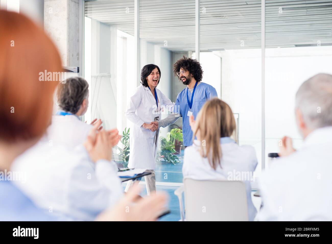 Group doctors listening medical expert hi-res stock photography and ...