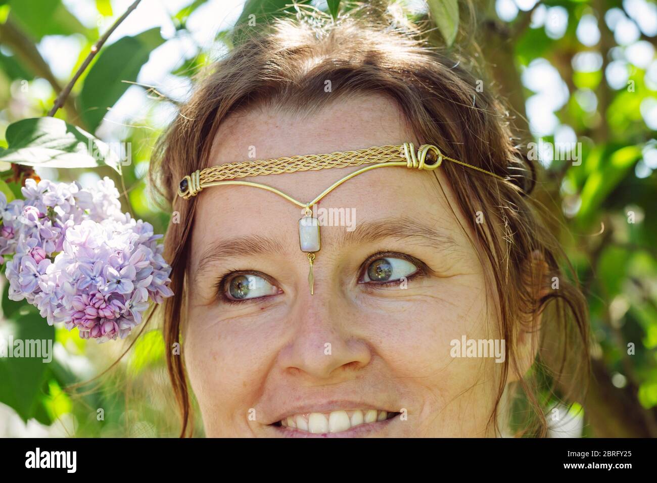 Closeup of young womans head wearing romantic metal tiara on her ...
