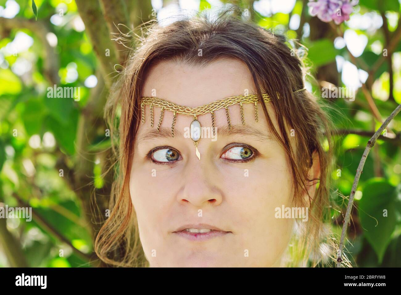 Closeup of young womans head wearing romantic metal tiara on her ...