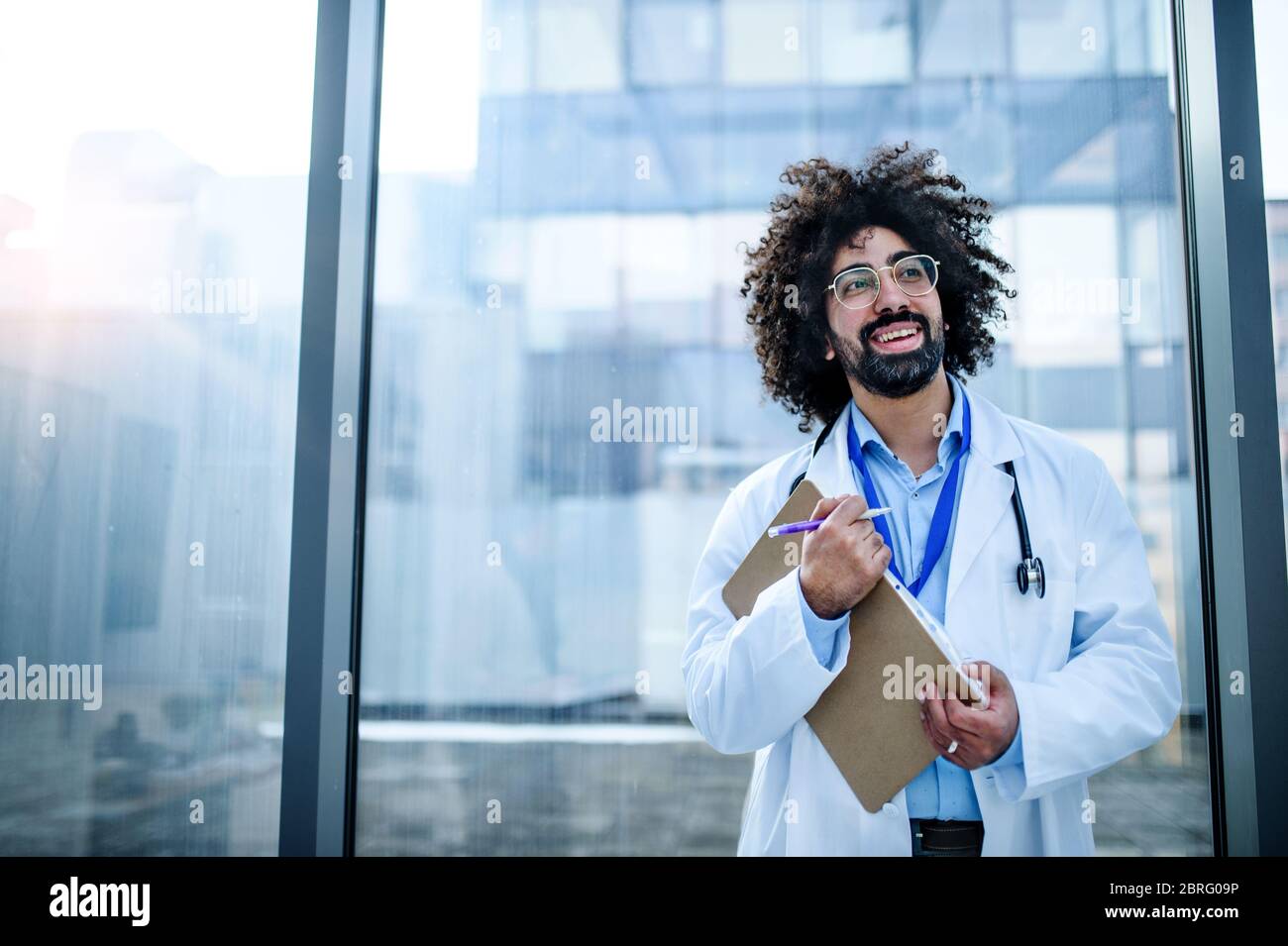 Professional doctor standing in front hi-res stock photography and ...