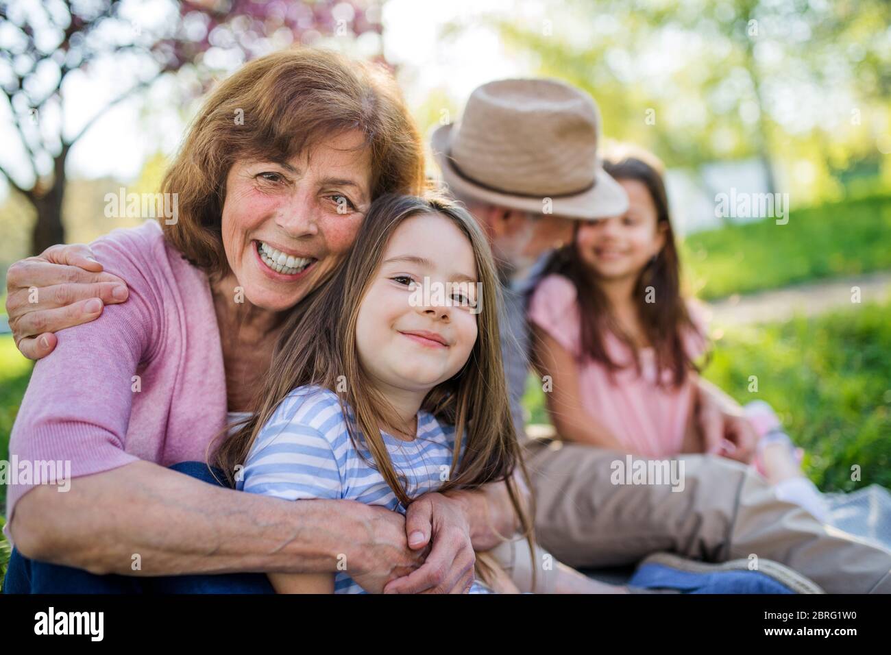 Old grandmother sitting in flower hi-res stock photography and images ...
