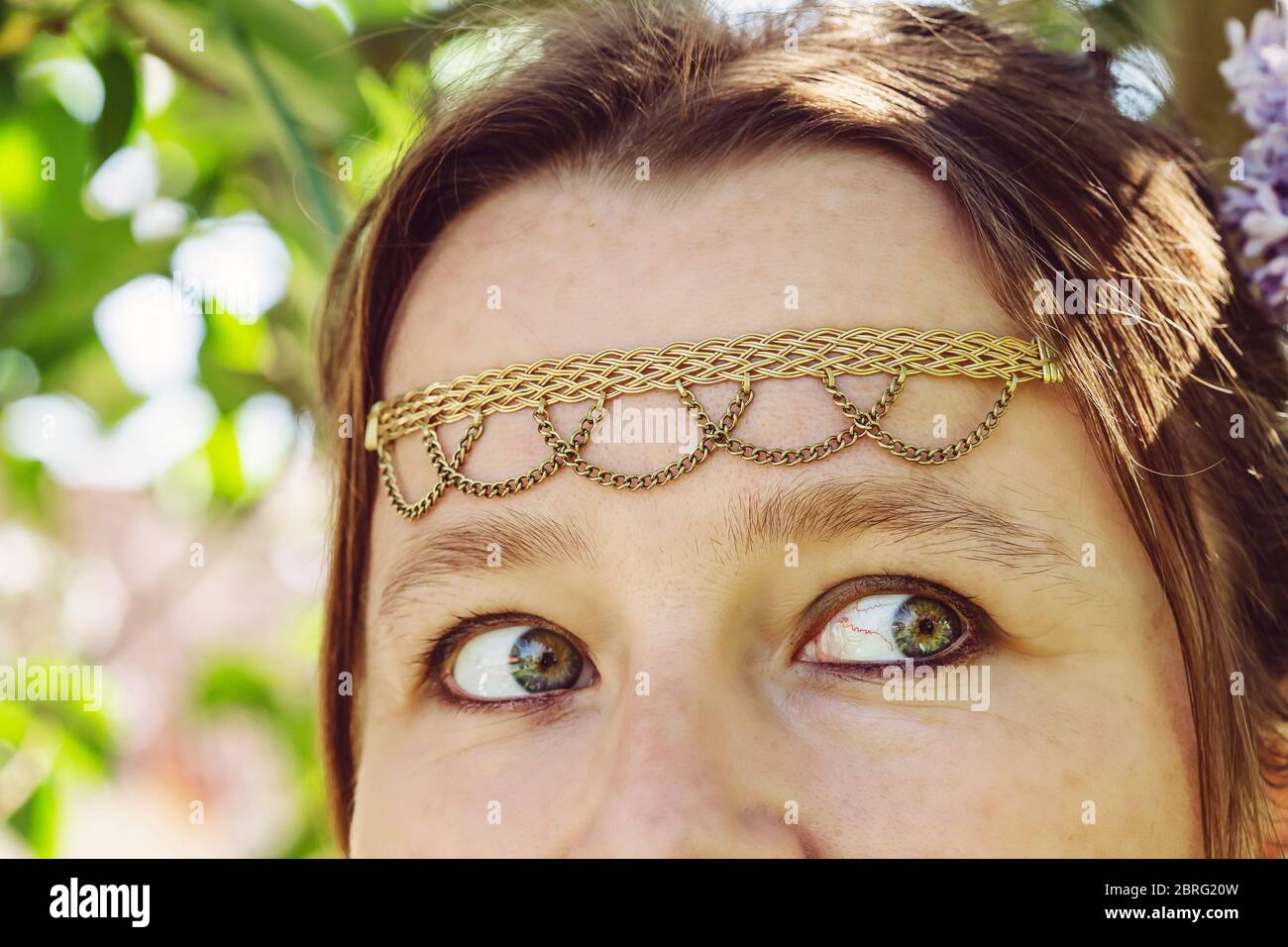 Closeup of young womans head wearing romantic metal tiara on her ...
