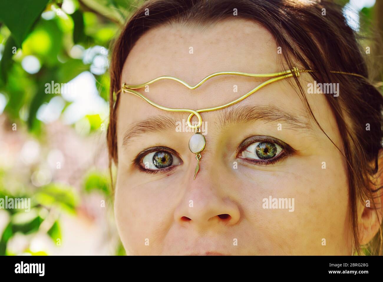 Closeup of young womans head wearing romantic metal tiara on her ...