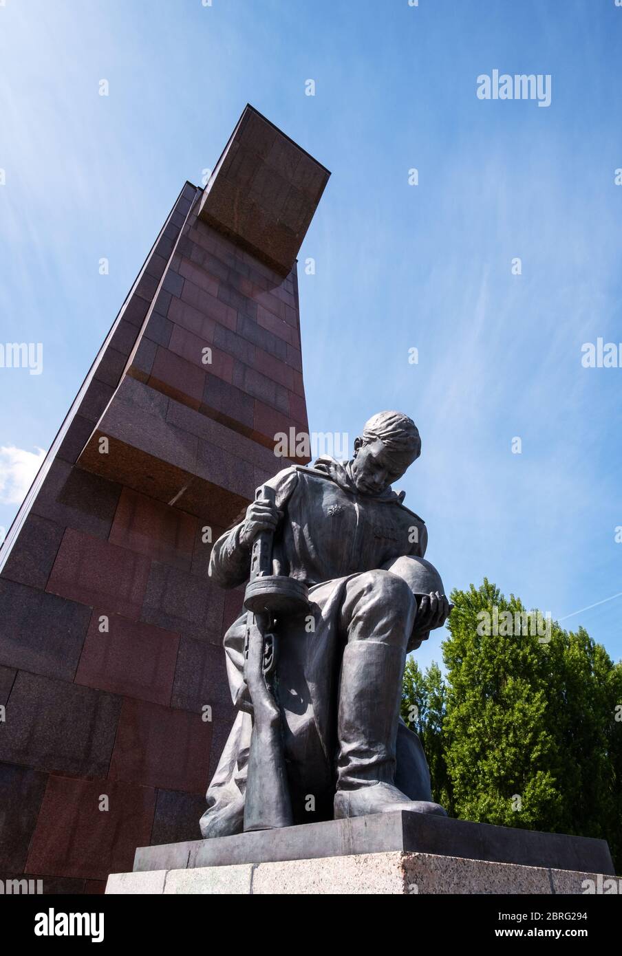 Statue of kneeling Soviet soldier at Soviet war memorial, Treptower ...