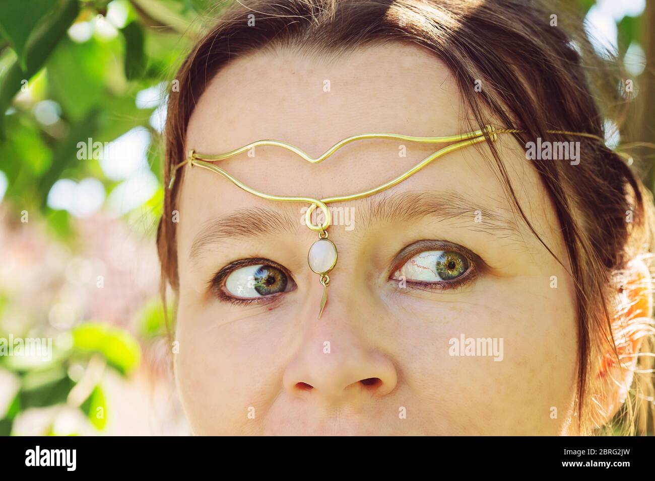 Closeup of young womans head wearing romantic metal tiara on her ...